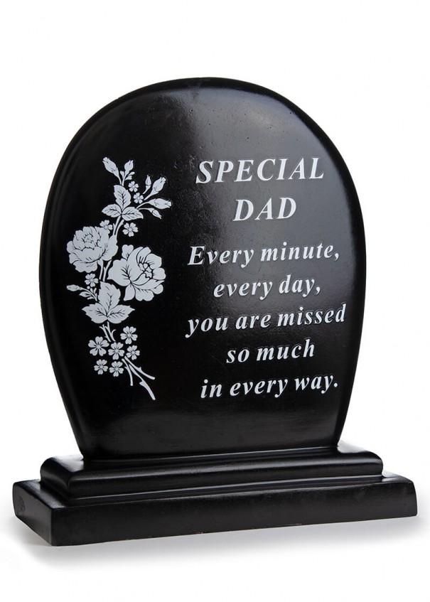 Rounded black graveside plaque with flower detail